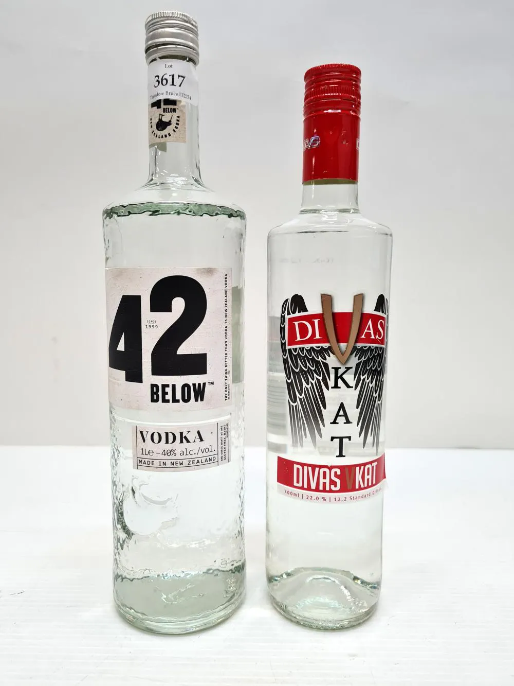 Two bottles of Vodka marked 42 Below Pure Vodka 1L & Divas Kat 700ml ...